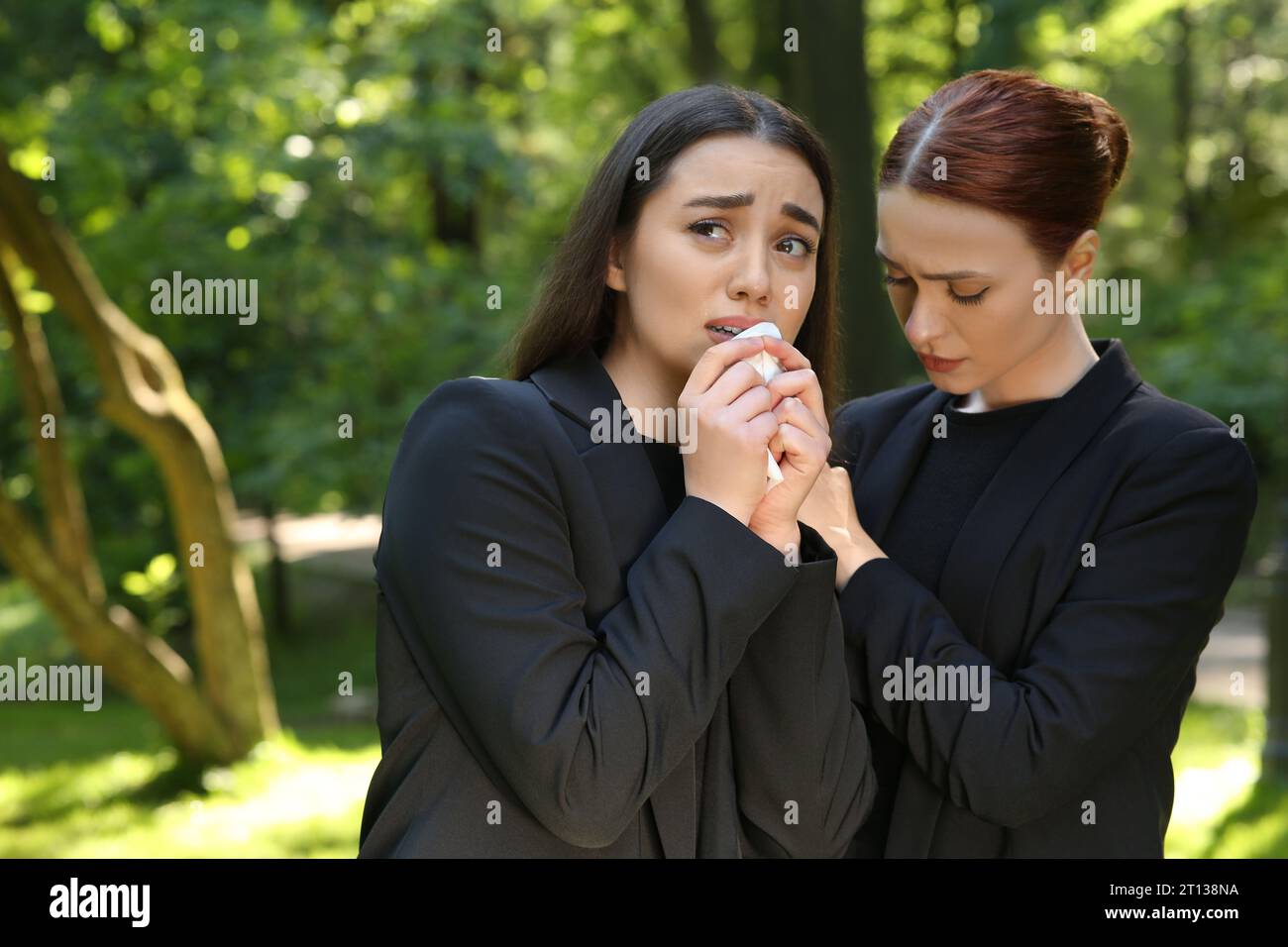 Women crying funeral hi-res stock photography and images - Alamy