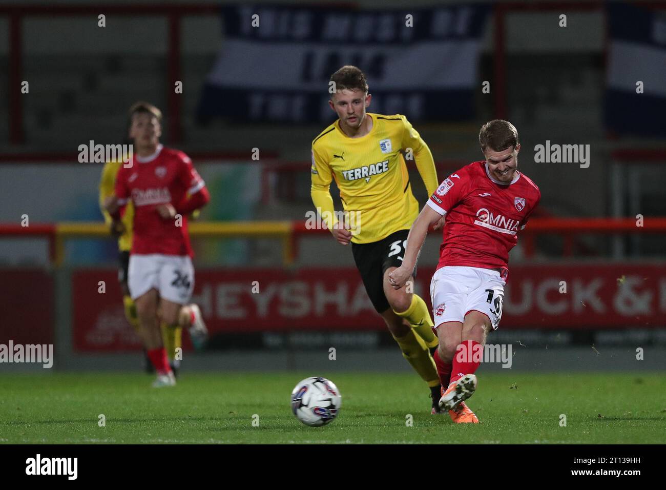 Morecambe's Jacob Davenport in action with Barrow's Sam Bellis during ...