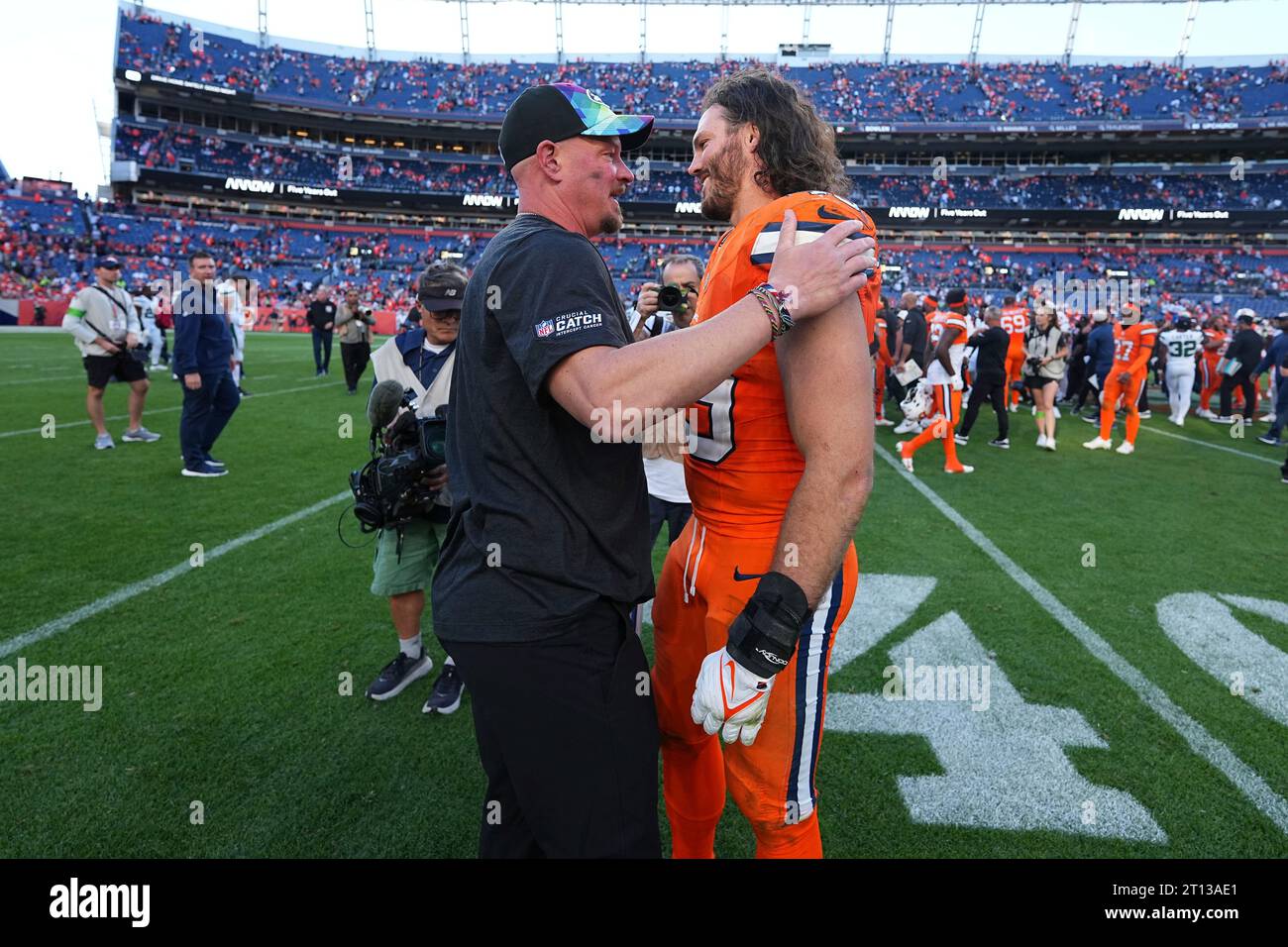 New York Jets Offensive Coordinator Nathaniel Hacker hugs Denver ...