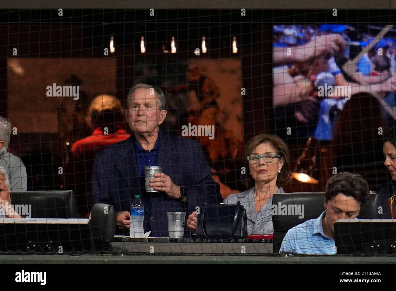 Former President George W. Bush and Laura Bush watch during the first ...