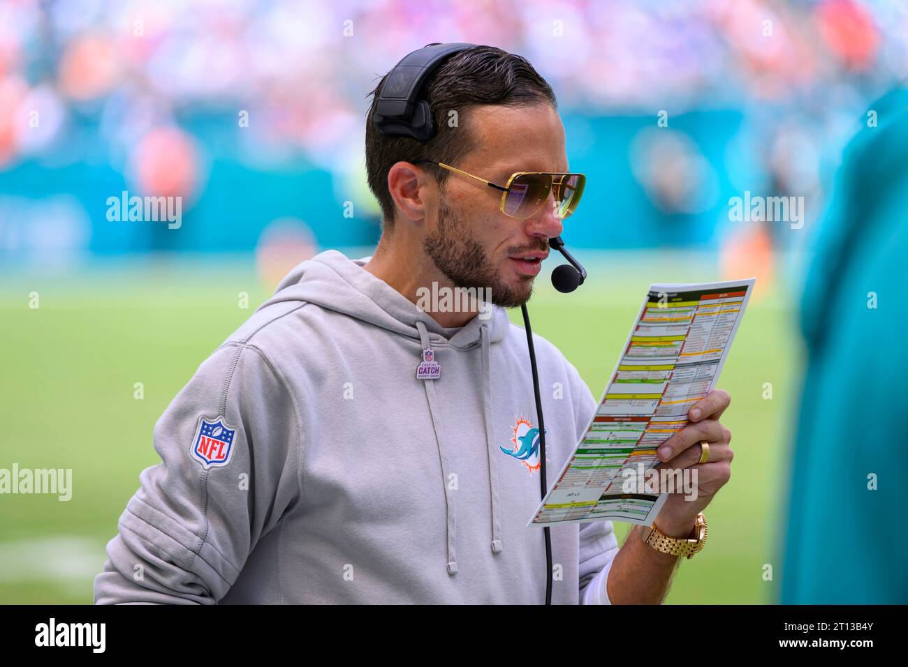 Miami Dolphins head coach Mike McDaniel looks at his play sheet on the sidelines during an NFL ...