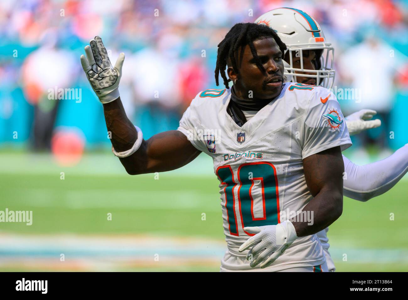 Miami Dolphins wide receiver Tyreek Hill (10) waves to fans in the ...