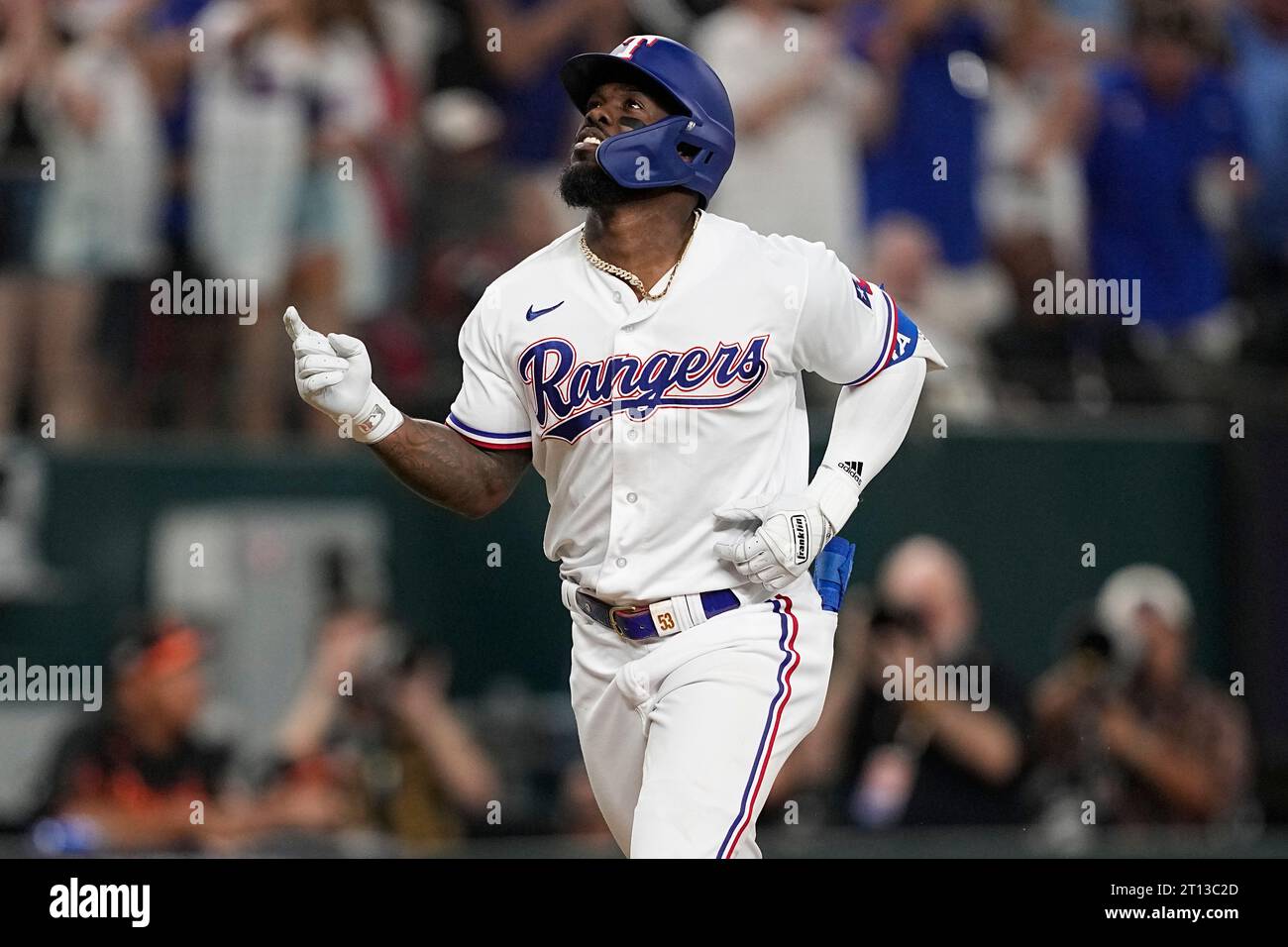 Texas Rangers' Adolis Garcia gestures after hitting a three-run home ...