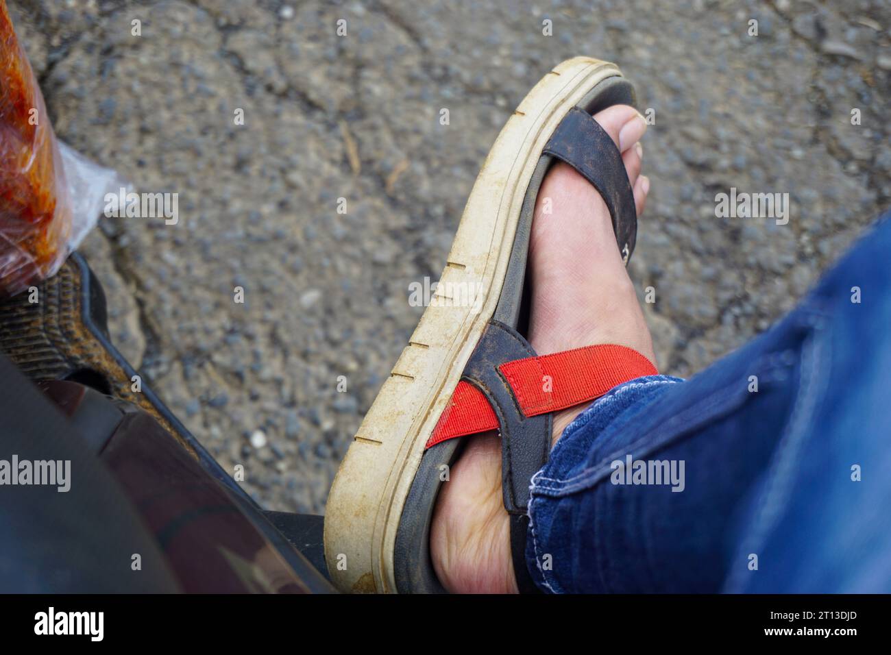 Stock photo of sandals and shoes being worn Stock Photo - Alamy