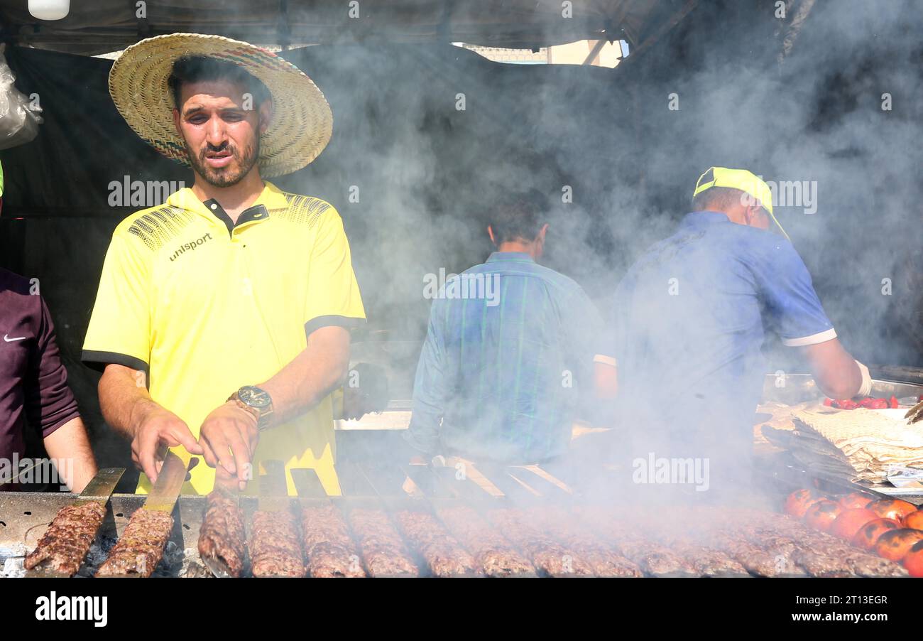 Tehran, Iran. 10th Oct, 2023. A man prepares specialty food during a ...