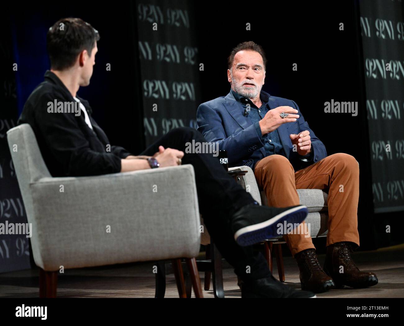 Arnold Schwarzenegger, right, speaks with Ryan Holiday about his book ...