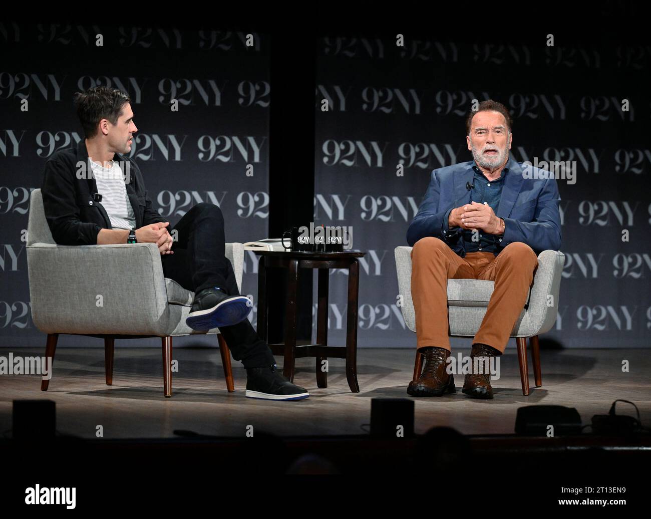 Arnold Schwarzenegger, right, speaks with Ryan Holiday about his book ...