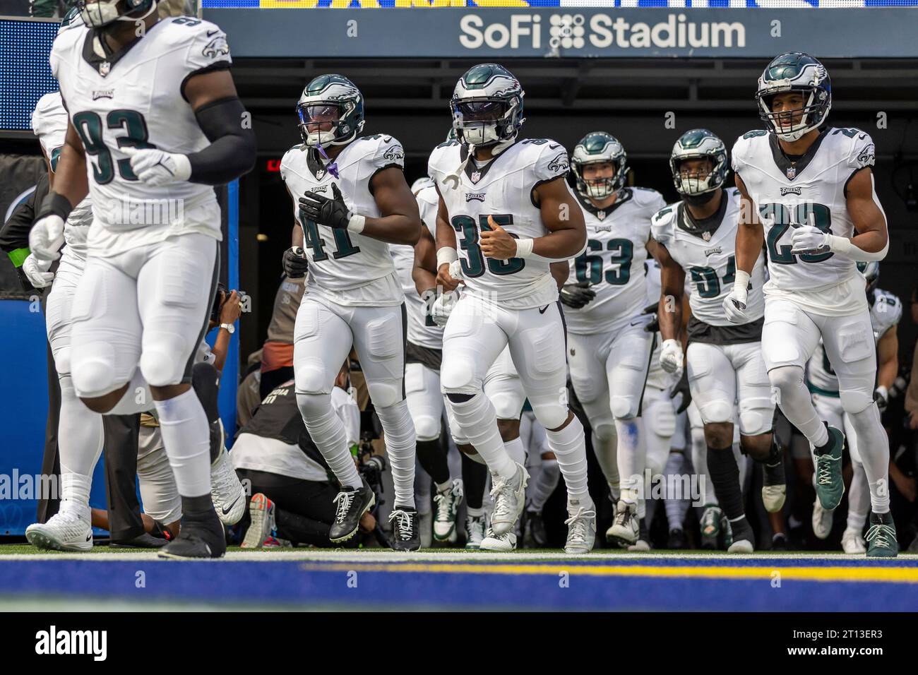 The Philadelphia Eagles run onto the field before playing against the ...
