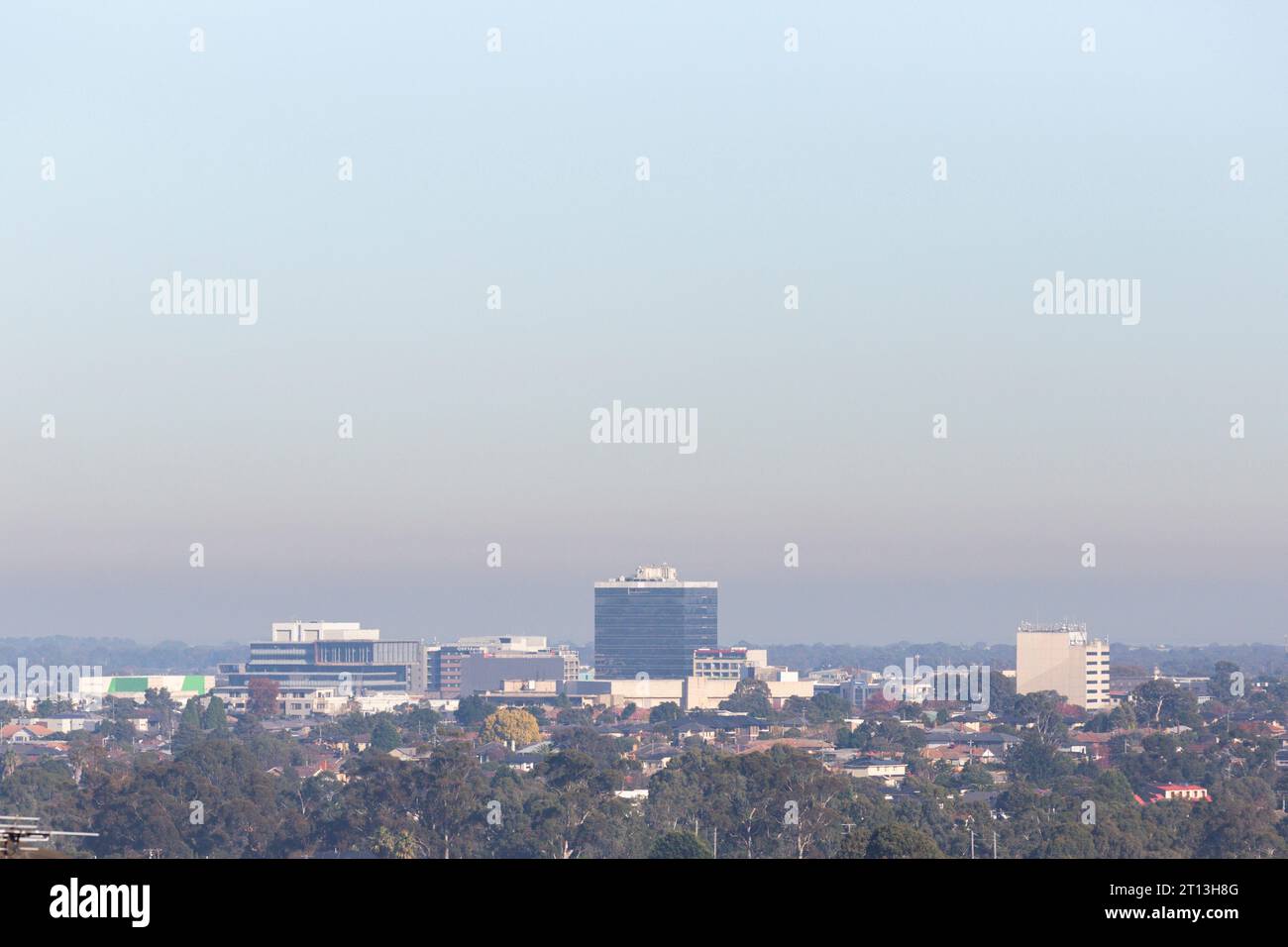 Light haze gently covers the cityscape after rain, contributing to a ...