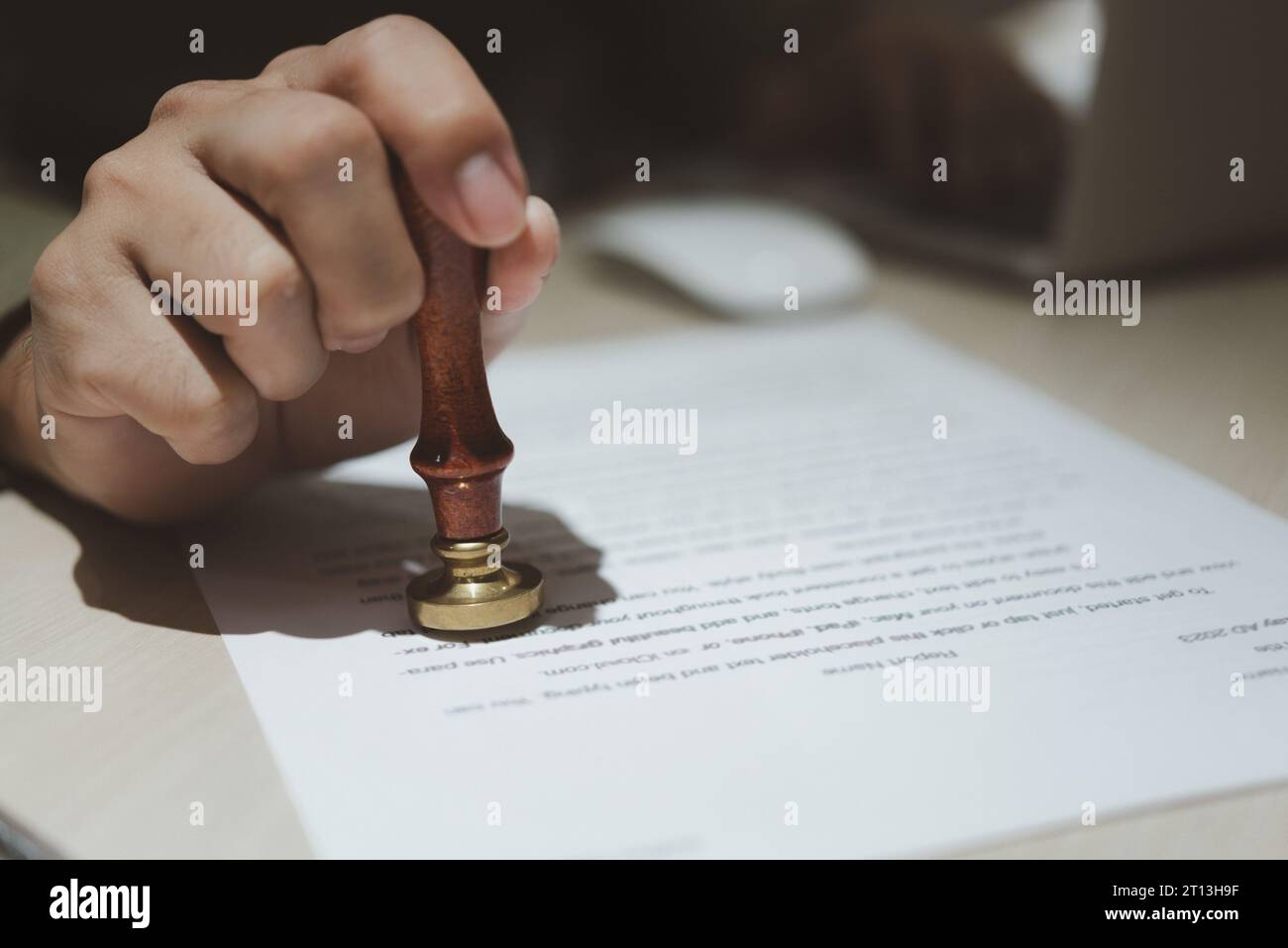 Hand holding rubber stamp on document paper.Approval job application ...