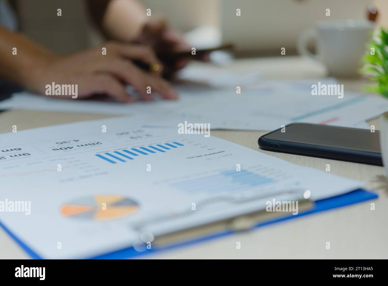 Business paperwork graphs data and reports chart on clipboard at desk ...