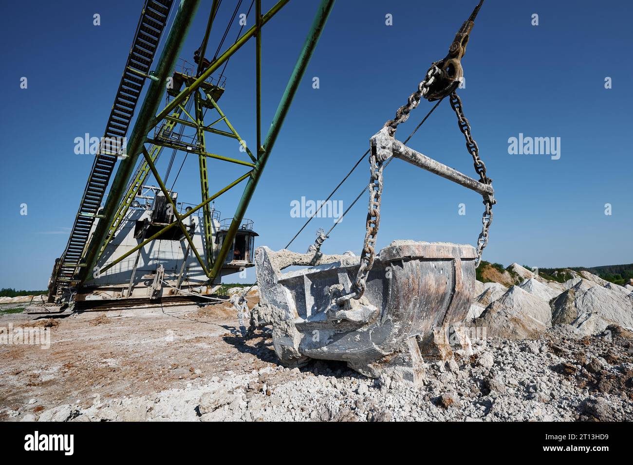 Empty bucket of modern dragline on ground at chalk quarry Stock Photo ...
