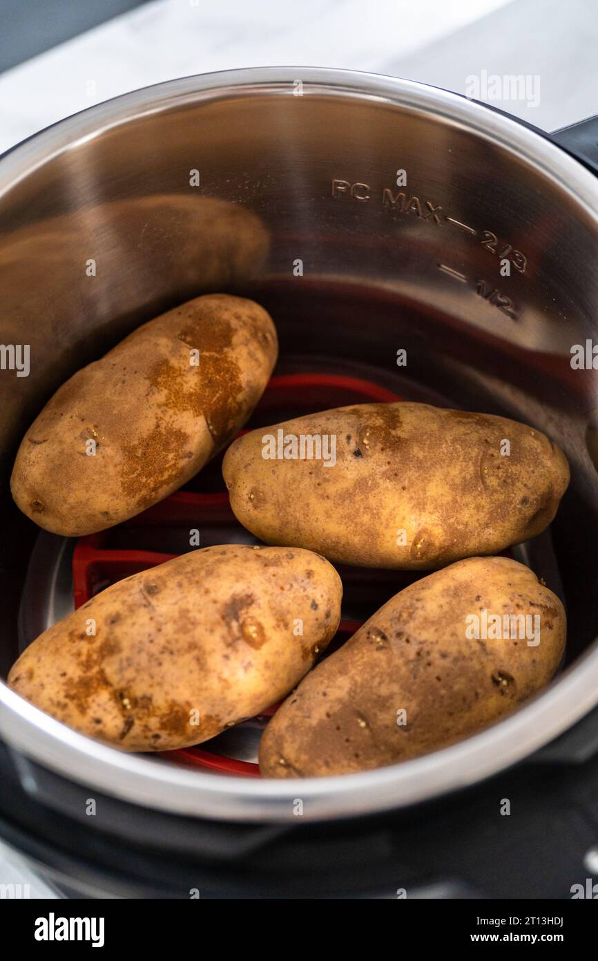 Pressure Cooker Baked Potatoes Stock Photo - Alamy