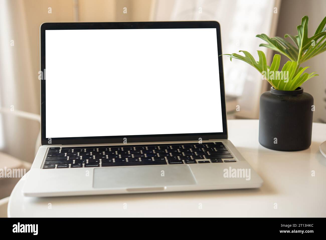 mock up laptop computer with white screen on table Stock Photo - Alamy
