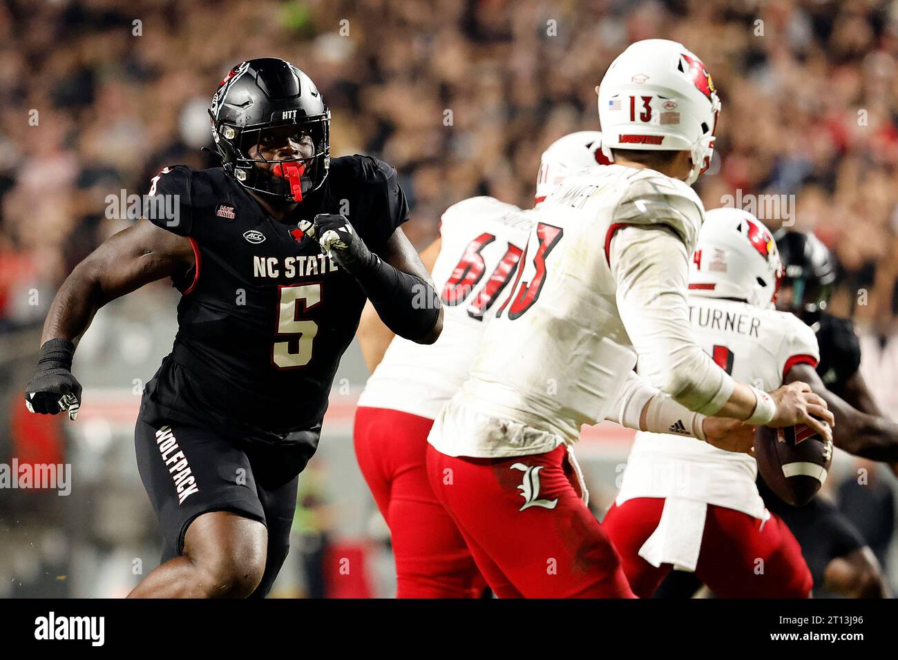 North Carolina State Defensive Tackle Cj Clark 5 Chases Louisville Quarterback Jack Plummer