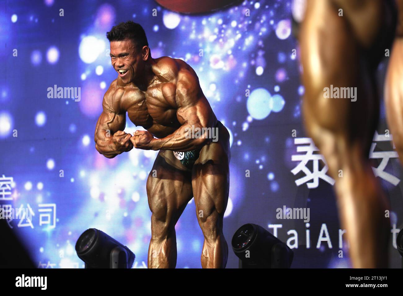Bodybuilders take part in a fitness competition in Tai'an City, east ...