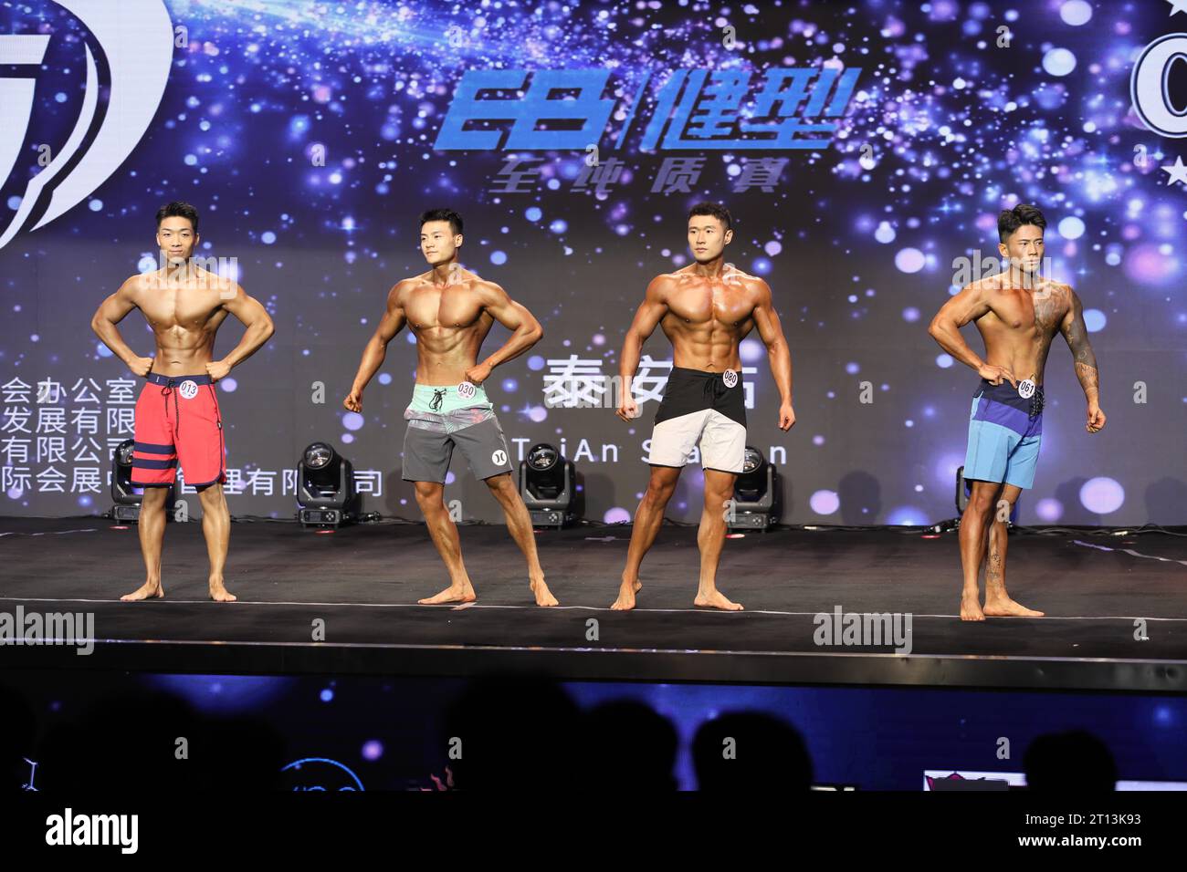 Bodybuilders take part in a fitness competition in Tai'an City, east ...