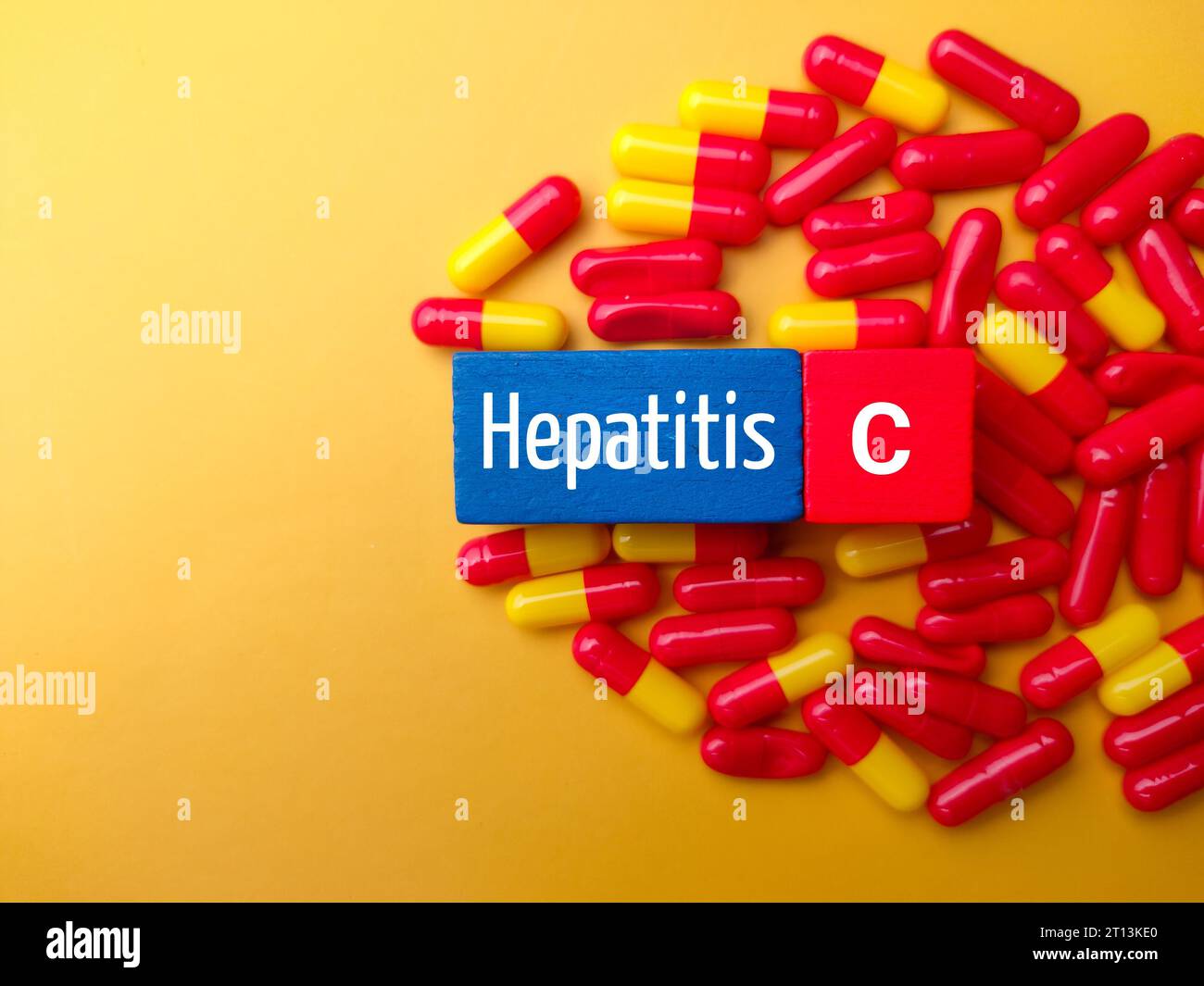 Top view medical pill and colored cube with the word Hepatitis C ...
