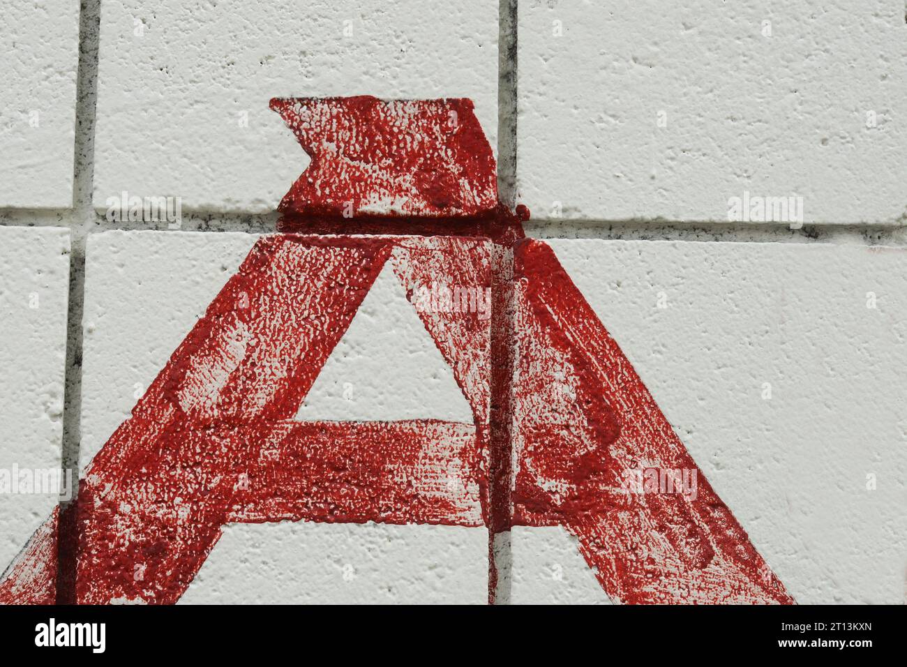 Faded letter A showing all its character of age, wear & usefulness ...