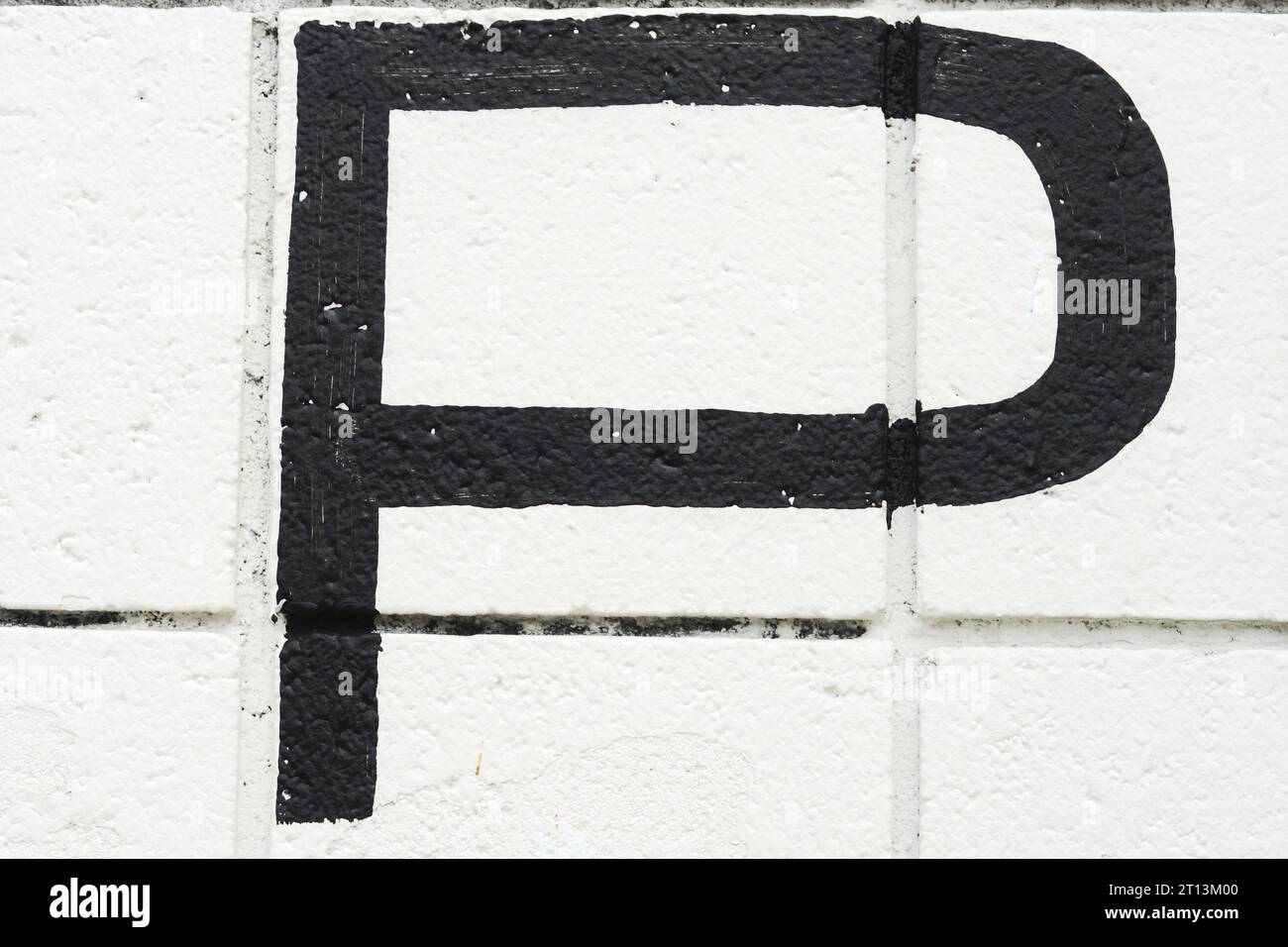 Faded letter P showing all its character of age, wear & usefulness ...