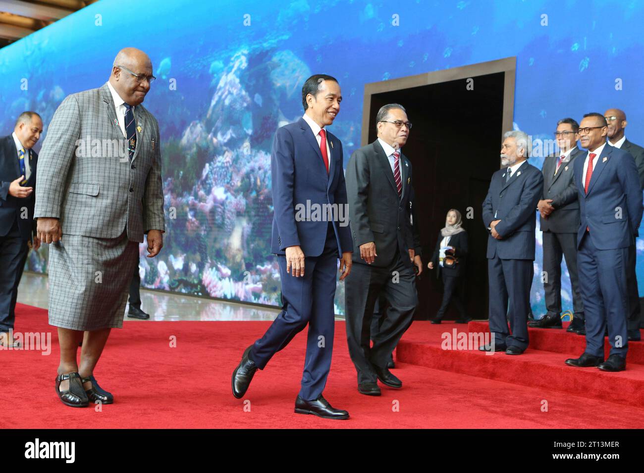 Indonesian President Joko Widodo, center left, walks with Fijian Deputy ...