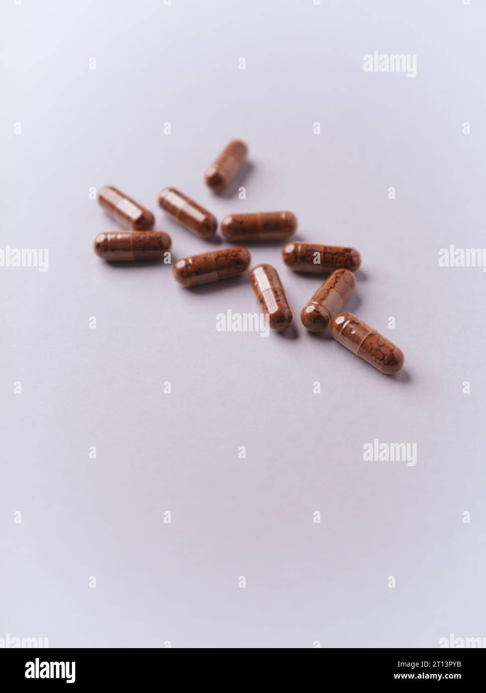 Ashwagandha (Withania somnifera) capsules. Paper background. Soft focus ...