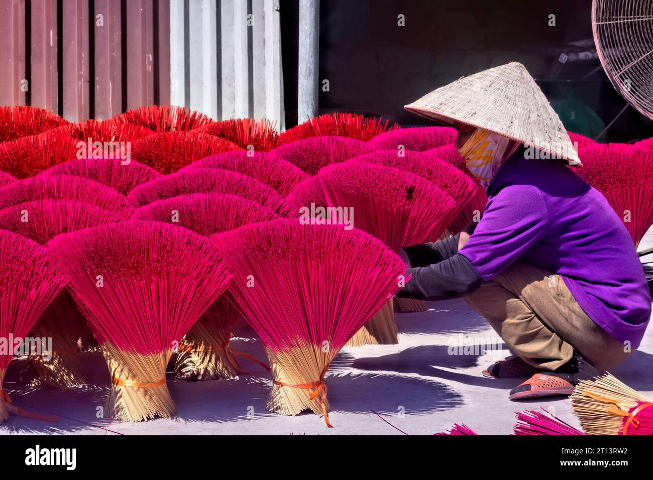 Worker drying incense in the Quang Phu Cau incense village, Hanoi ...
