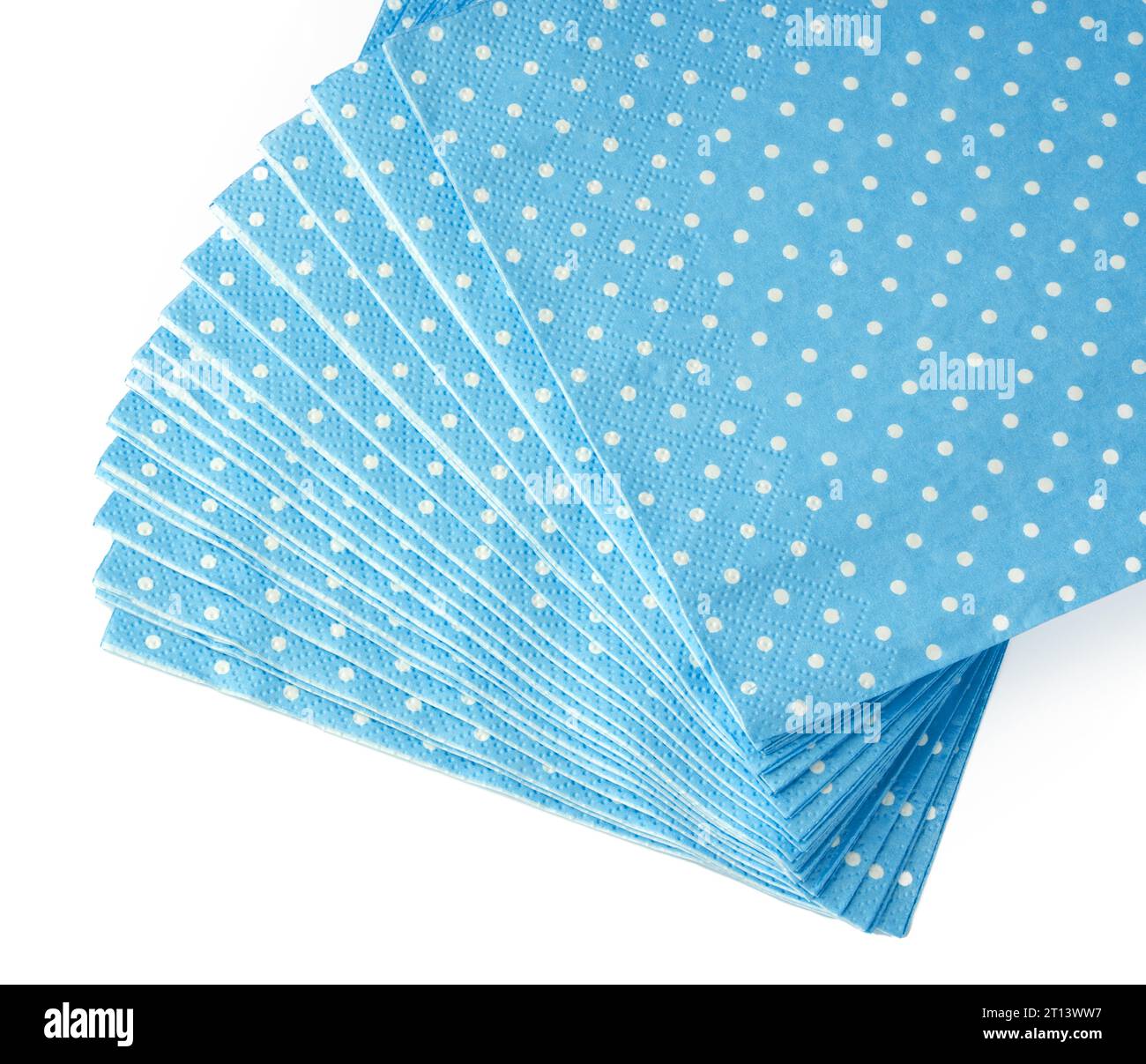 Stack of blue dotted paper napkins isolated on white Stock Photo - Alamy