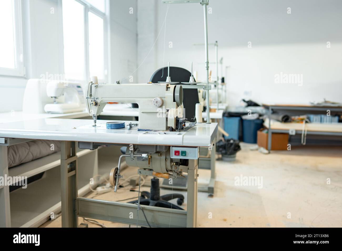 Interior of a sewing warehouse of furniture factory with equipment and ...