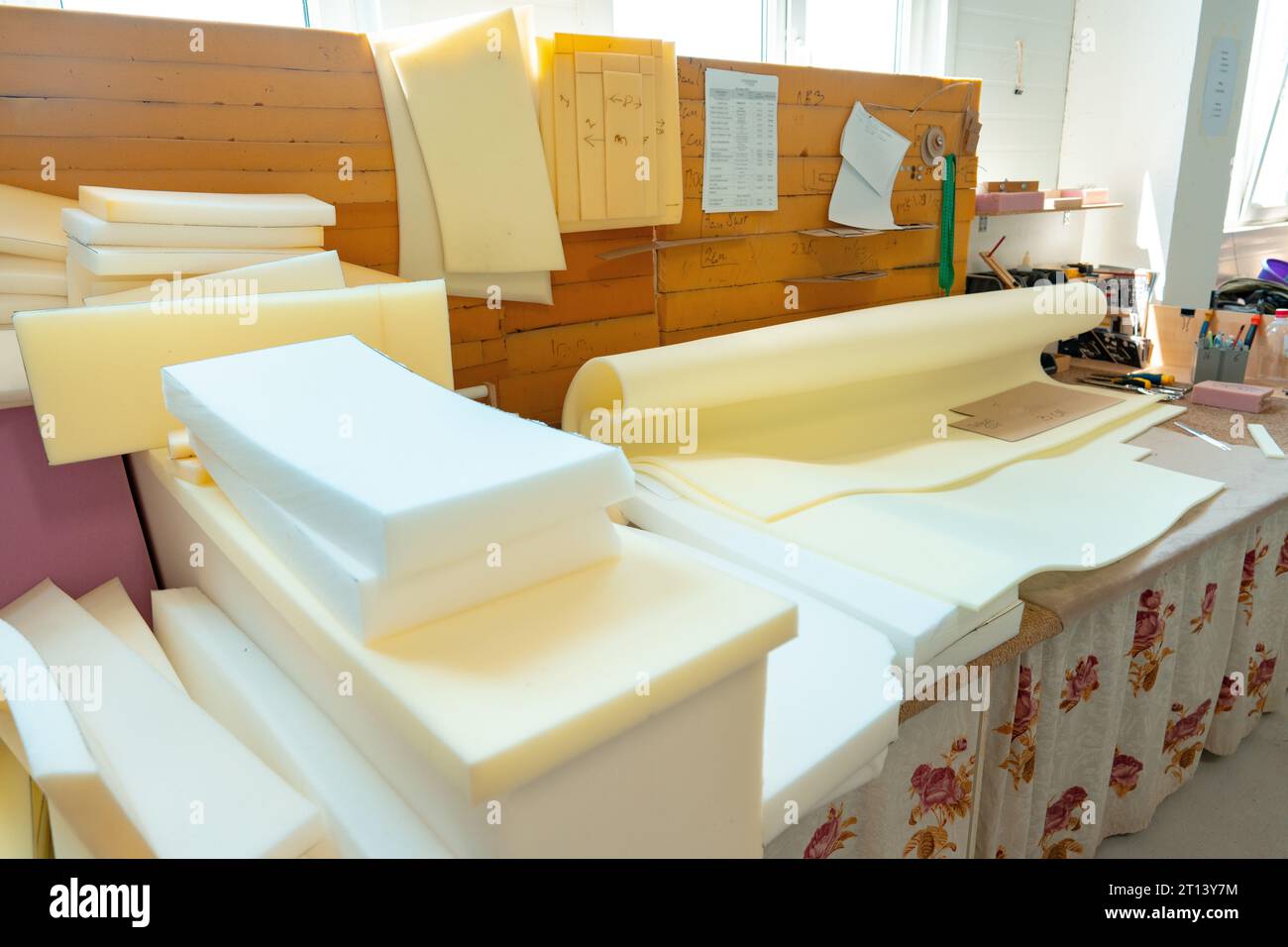 Stacked sheets of foam rubber for furniture production in factory ...