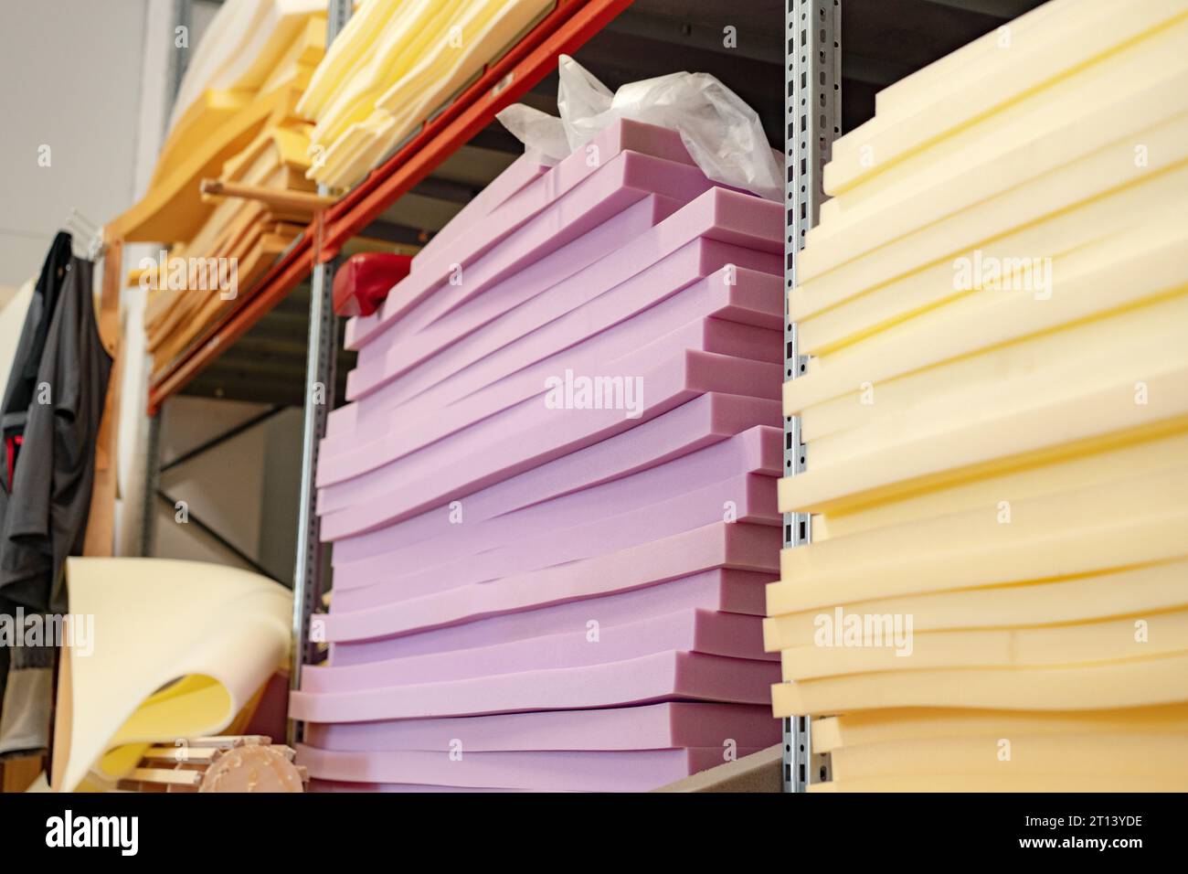 Stacked sheets of foam rubber for furniture production in factory ...