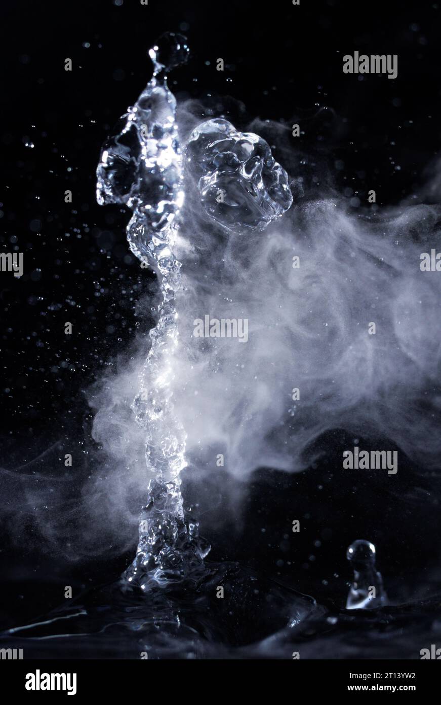 Boiling water splash with steam on black background closeup Stock Photo ...