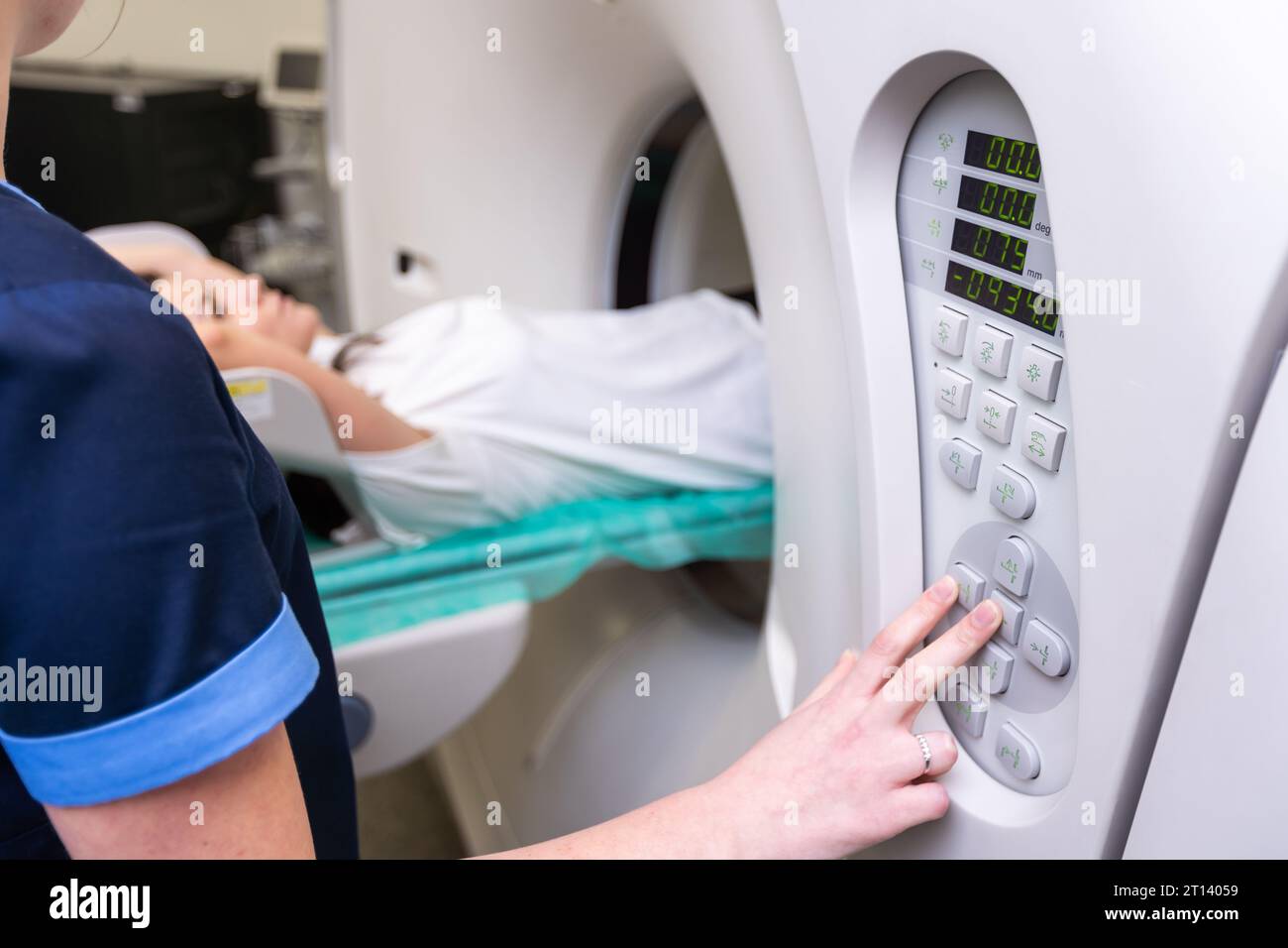 hand of doctor operating Computed Tomography device Stock Photo - Alamy