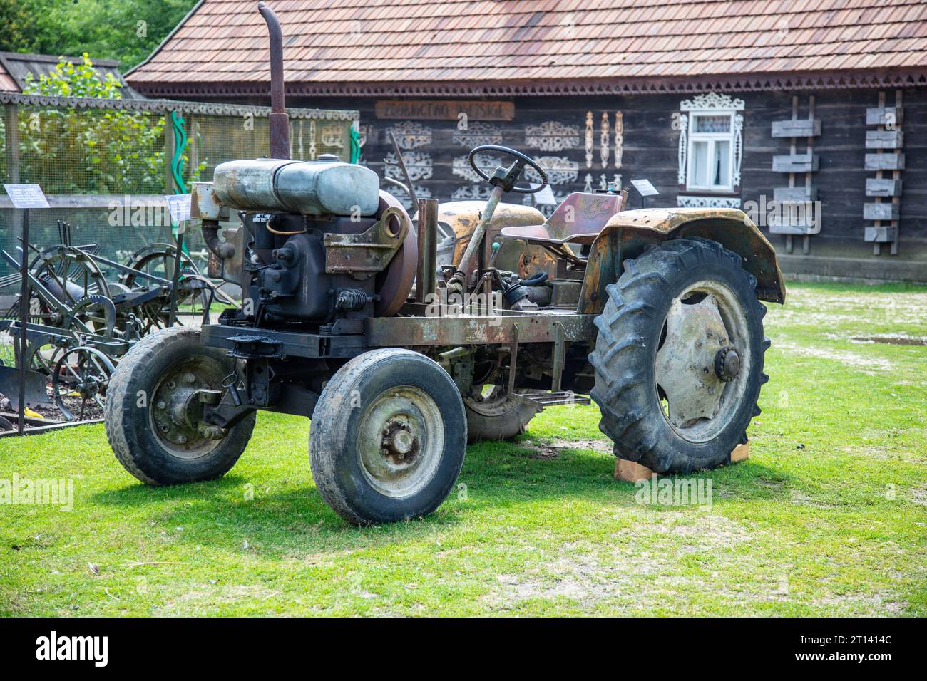 very old tractor is standing outside Stock Photo - Alamy
