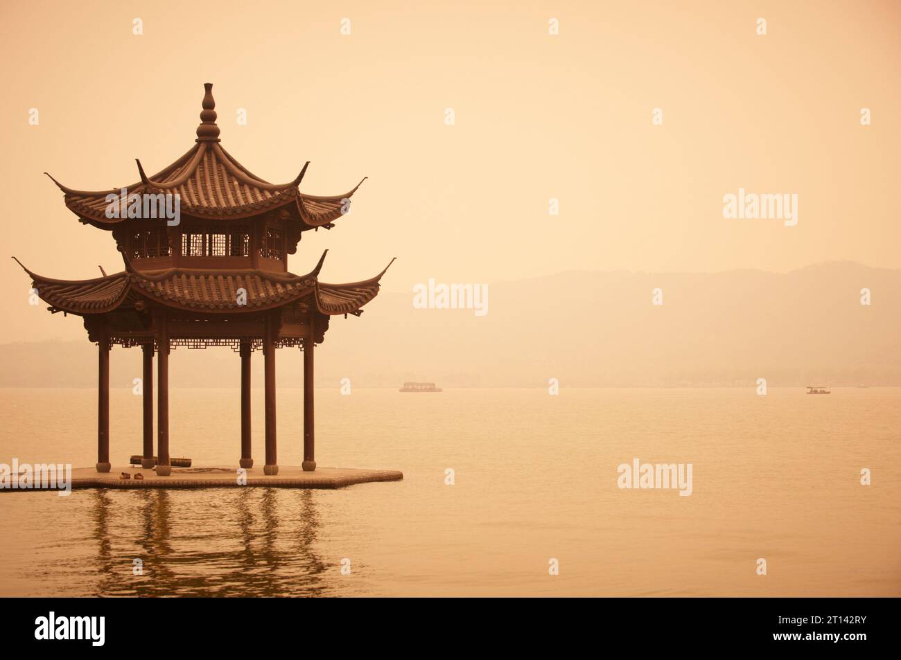 Chinese traditional wooden gazebo on the coast of West Lake, public ...
