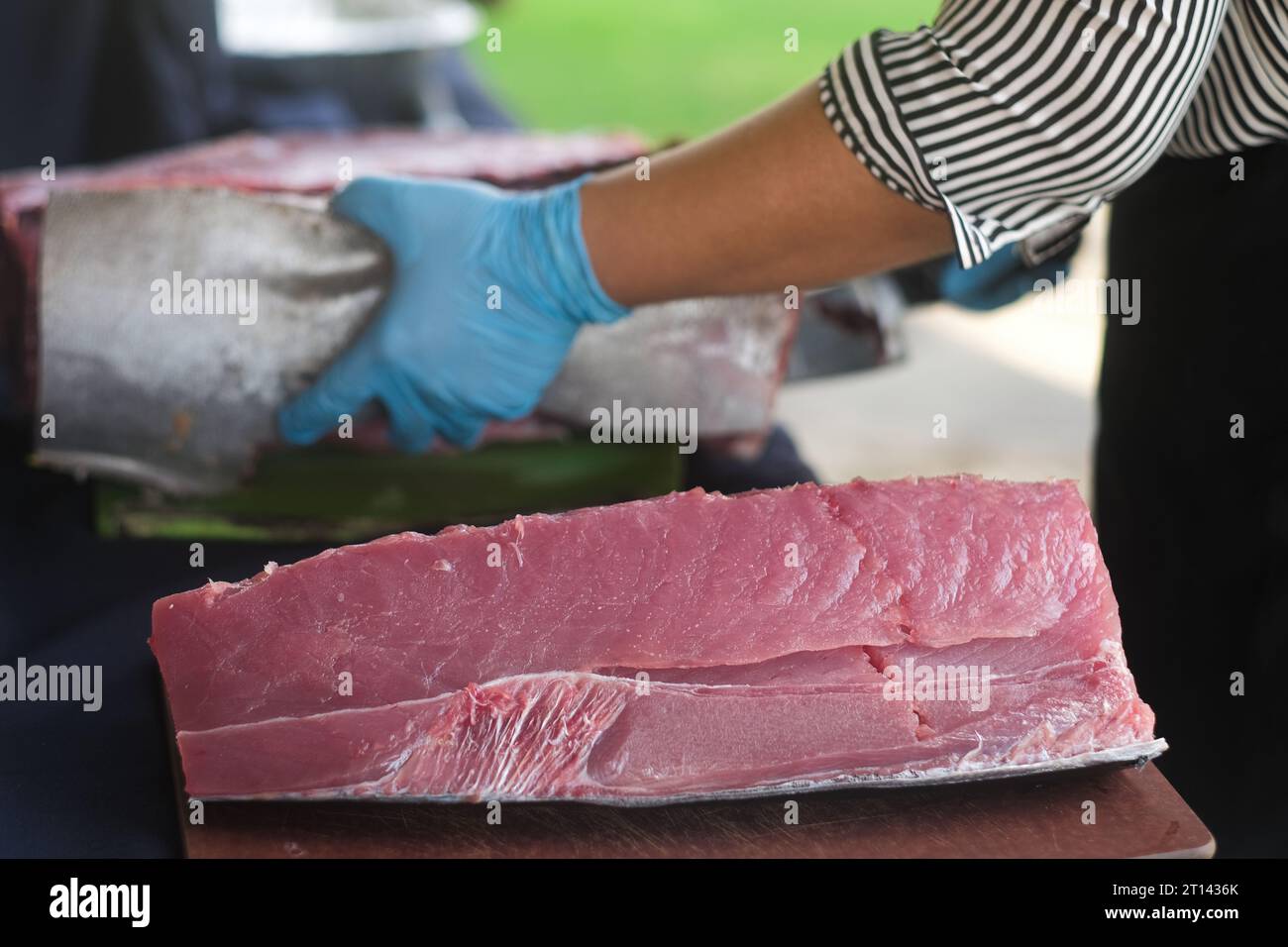 Hands in gloves cut seafood hi-res stock photography and images - Alamy