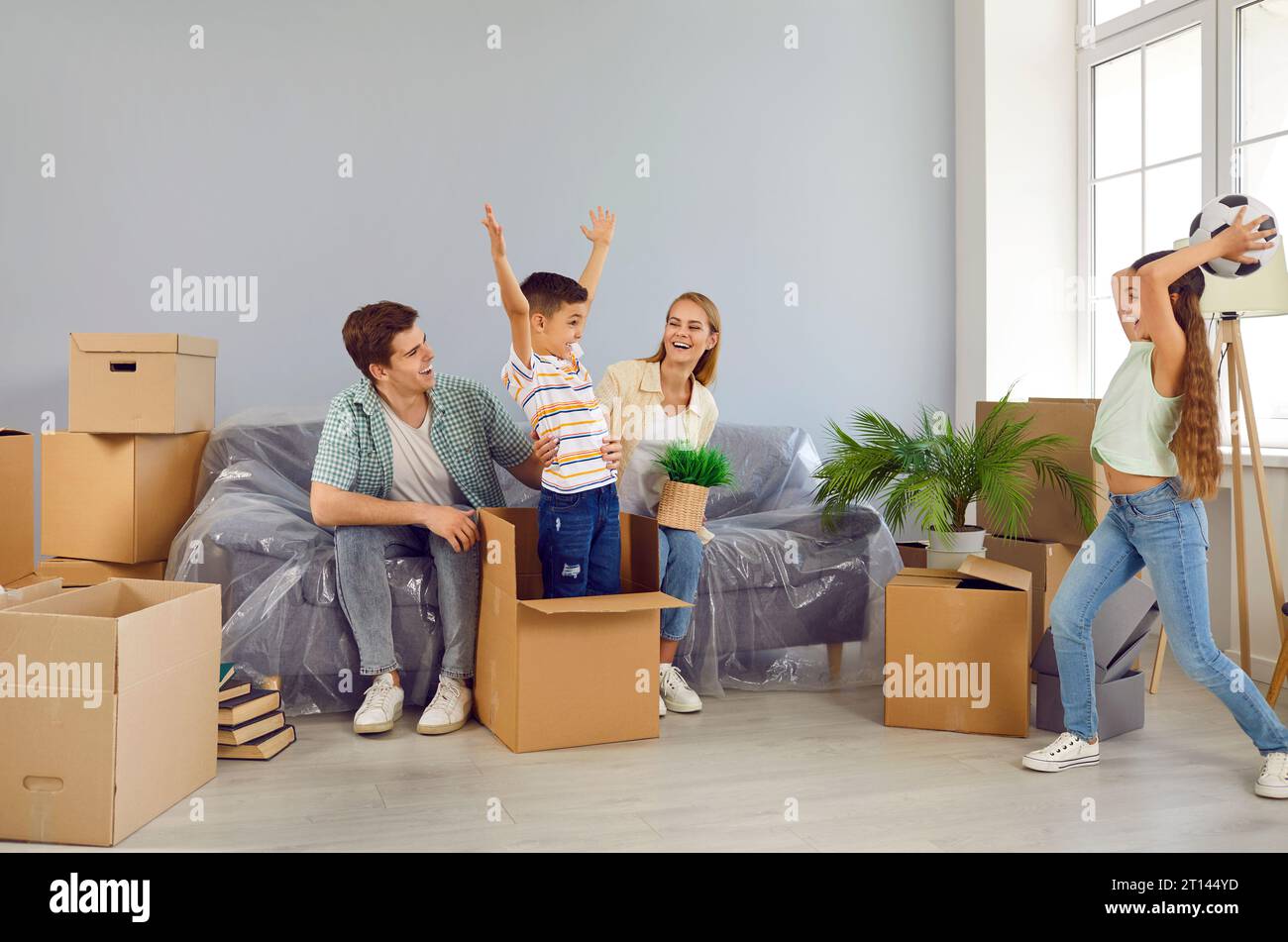 Active joyful children enjoy moving day and play, have fun and fool ...