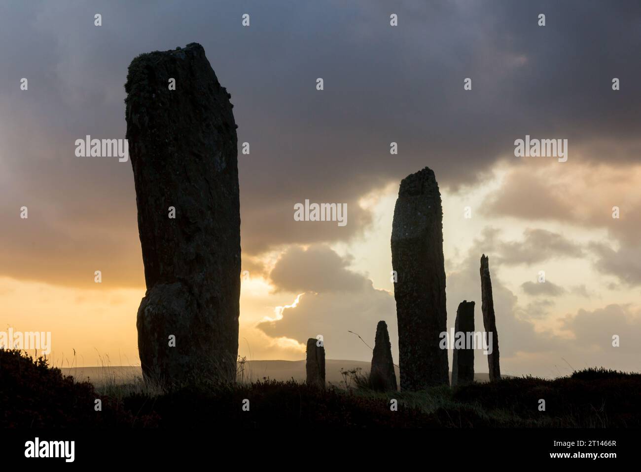 The sun rises behind the neolithic standing stones of the Ring of ...