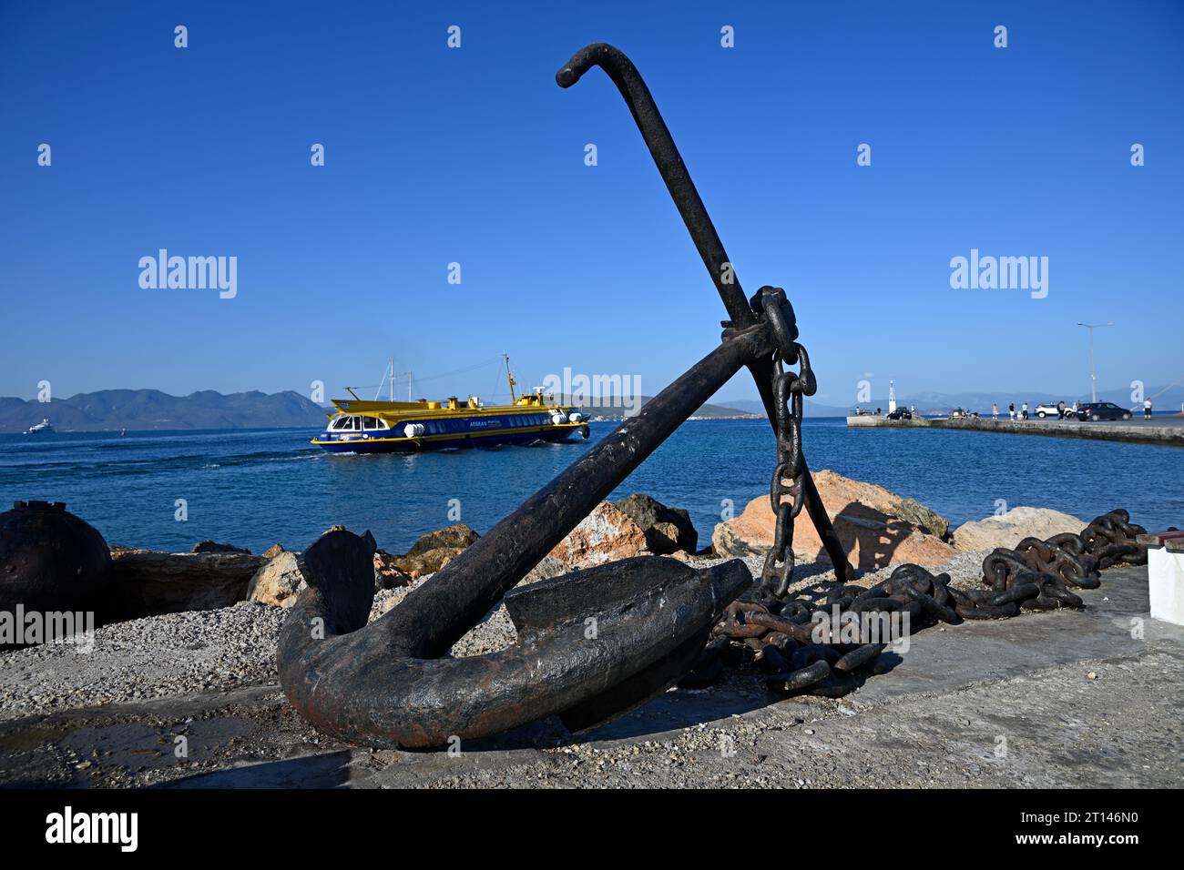 An old anchor in Aegina port, Aegina island, Greece Stock Photo - Alamy