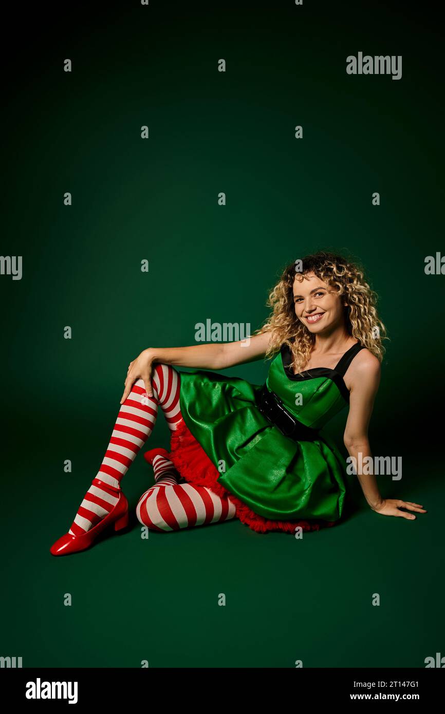 happy pretty woman dressed as new year elf smiling cheerfully at camera ...