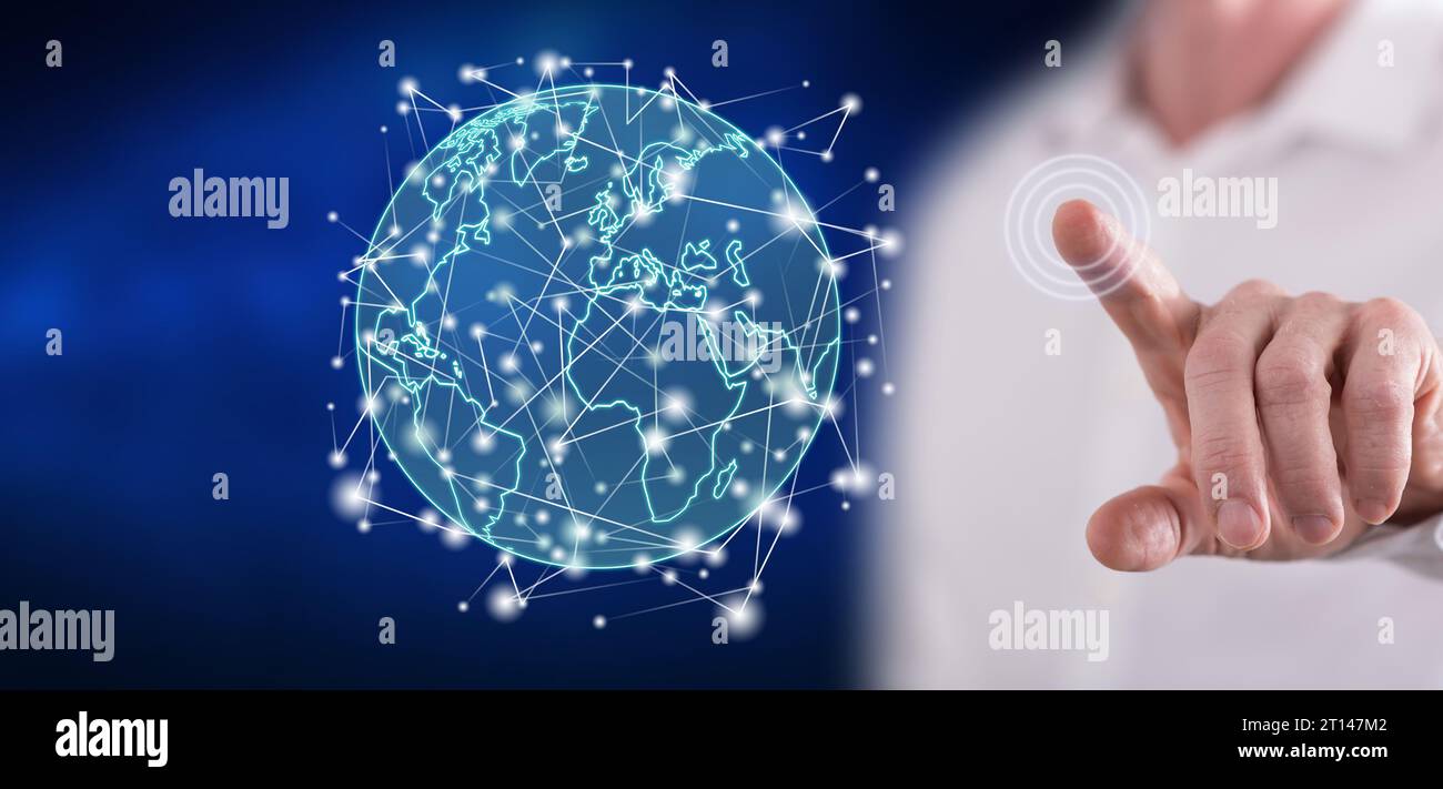 Man touching a global connection concept on a touch screen with his ...