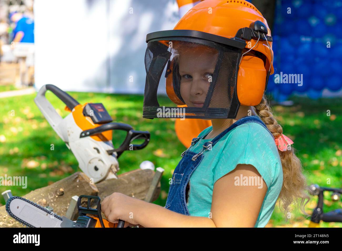 Child woodcutter with chainsaw hi-res stock photography and images - Alamy