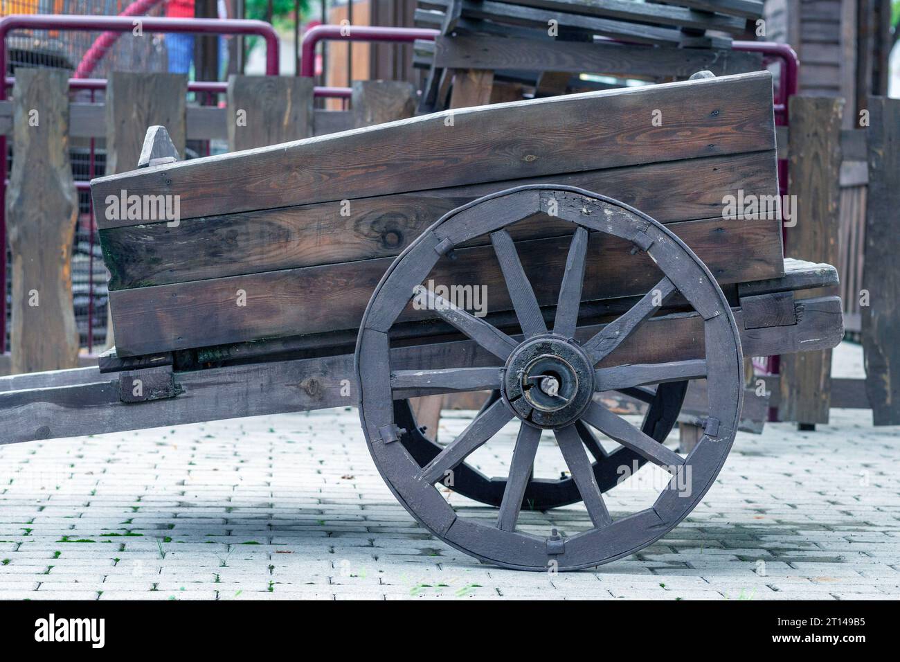 Antiquarian transport. Old wooden two-wheeled cart, vehicle. side view ...