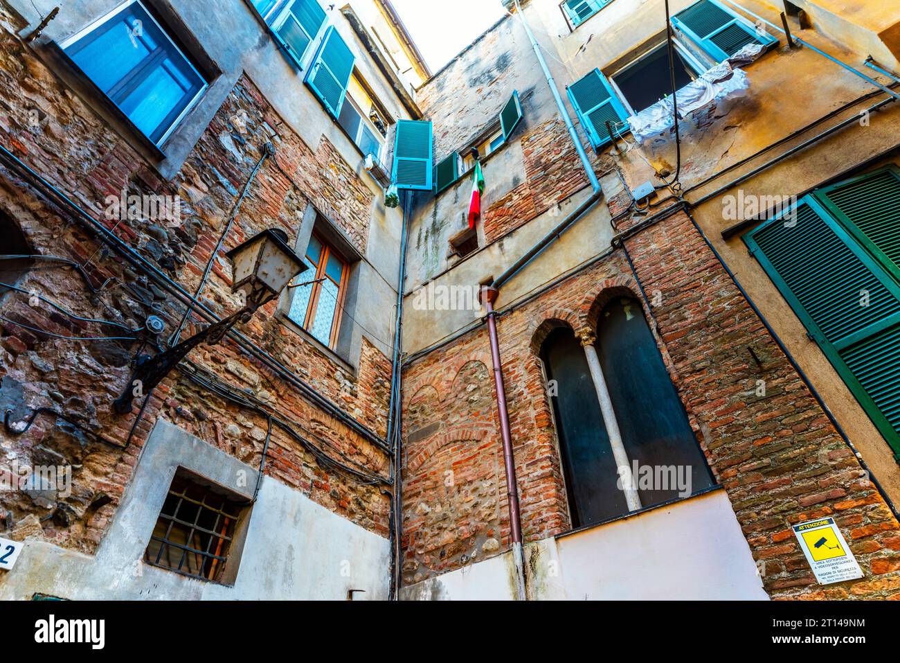Medieval facade in old town of Albenga, Italy. Albenga is a city ...