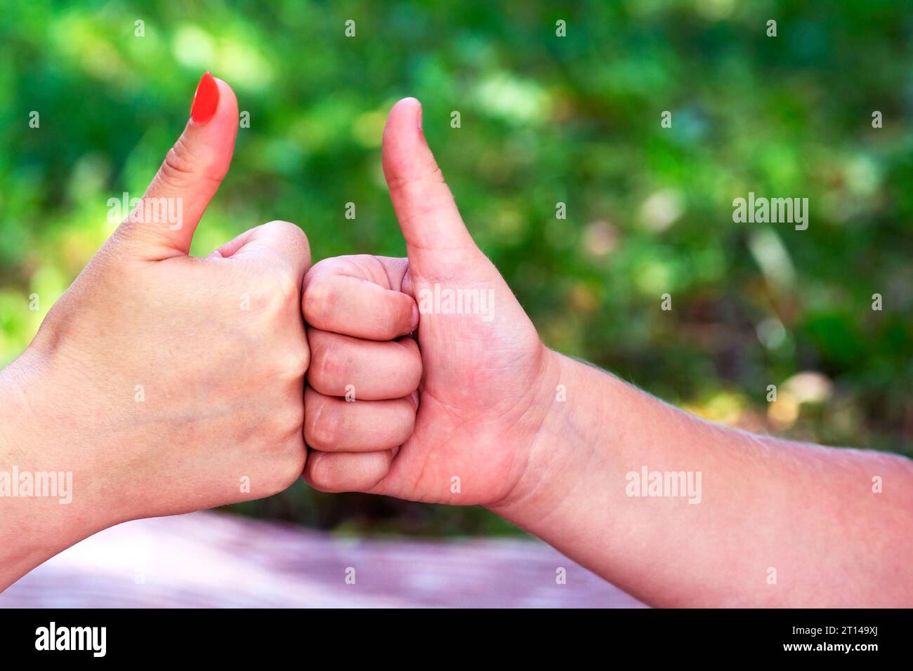 hand showing thumbs up sign. sign a finger in top. Good work ...