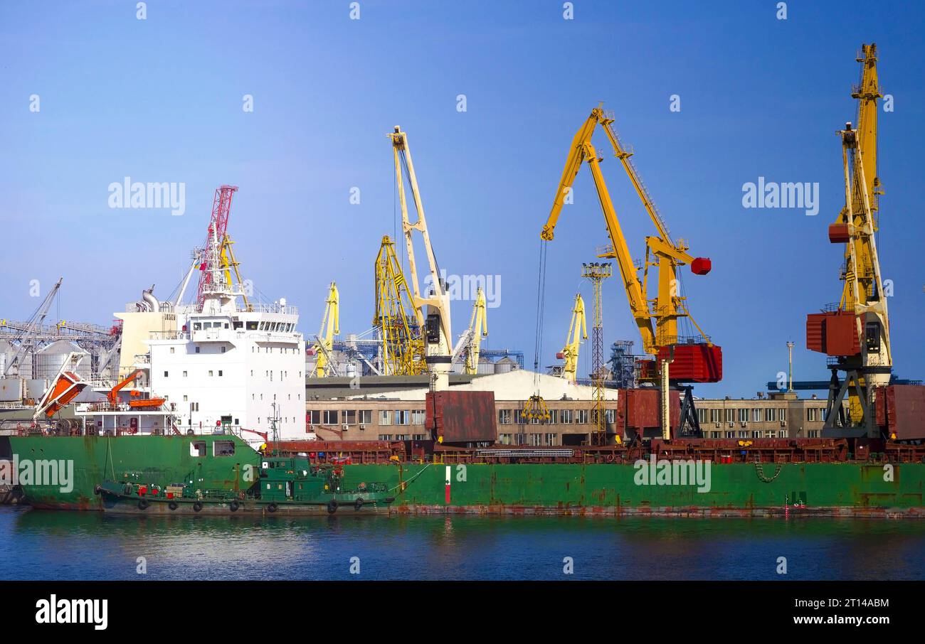 Port Cranes on a Pier of Seaport. Industrial freight.Container terminal ...