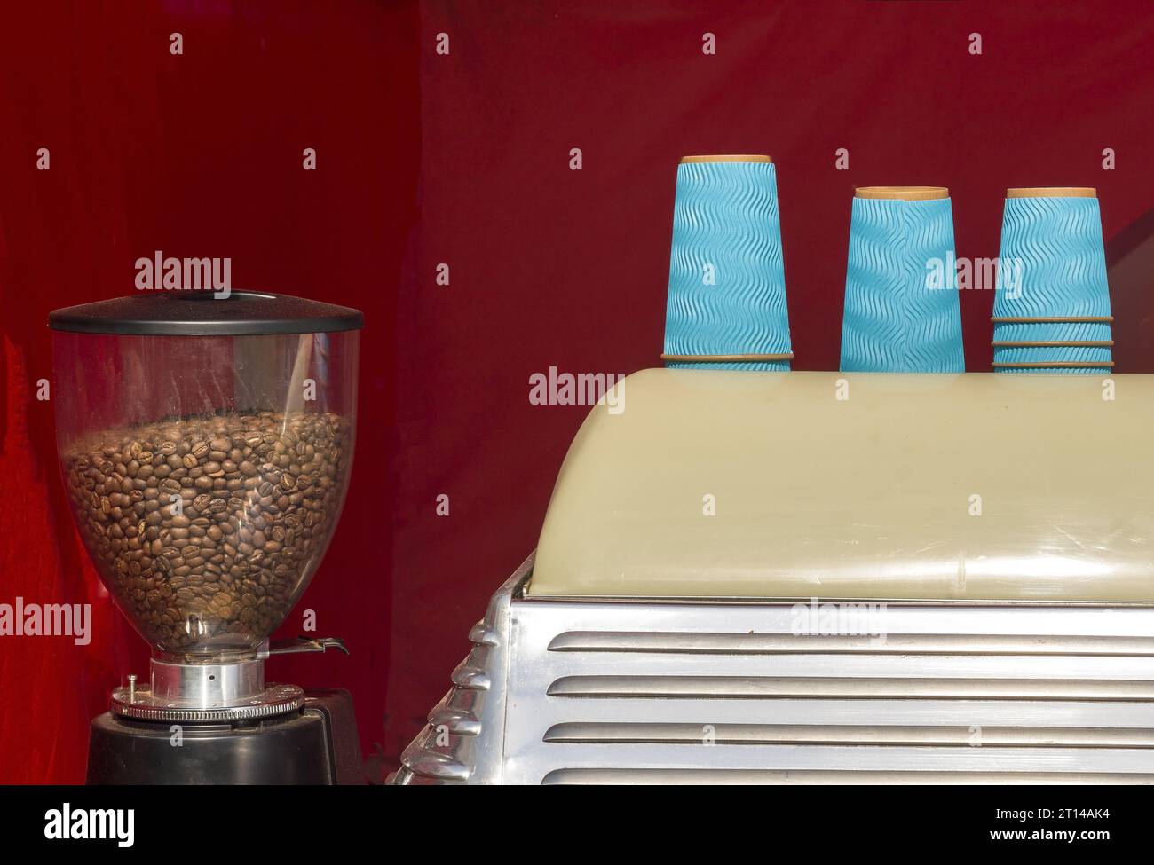 Coffee house device, machine. coffee paper cup. Seeds on a red ...