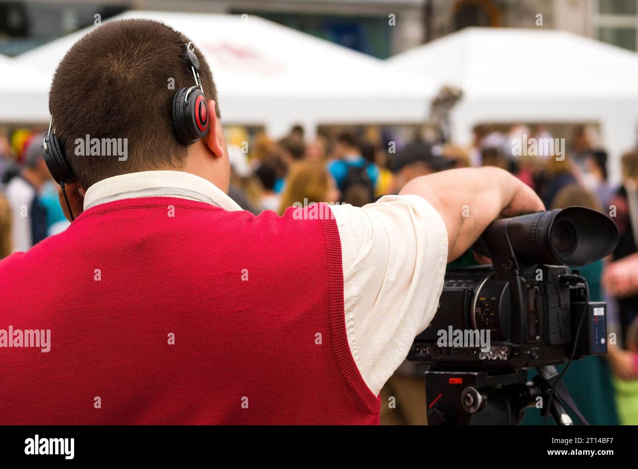 The photographer in work. Photographer with a camera. cameraman with ...