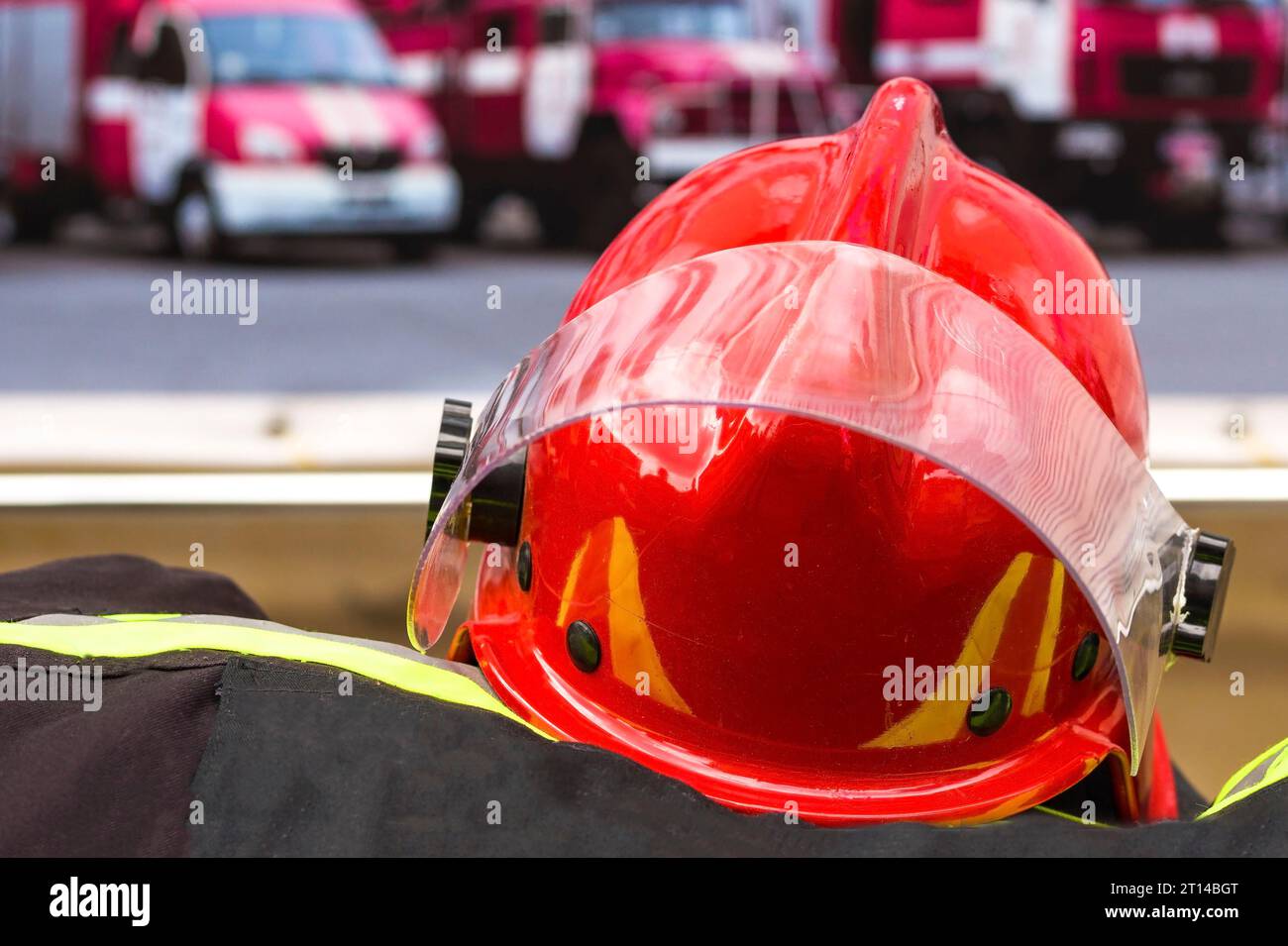 Firefighter uniform with red helmet. image of a red helmet of a fireman ...