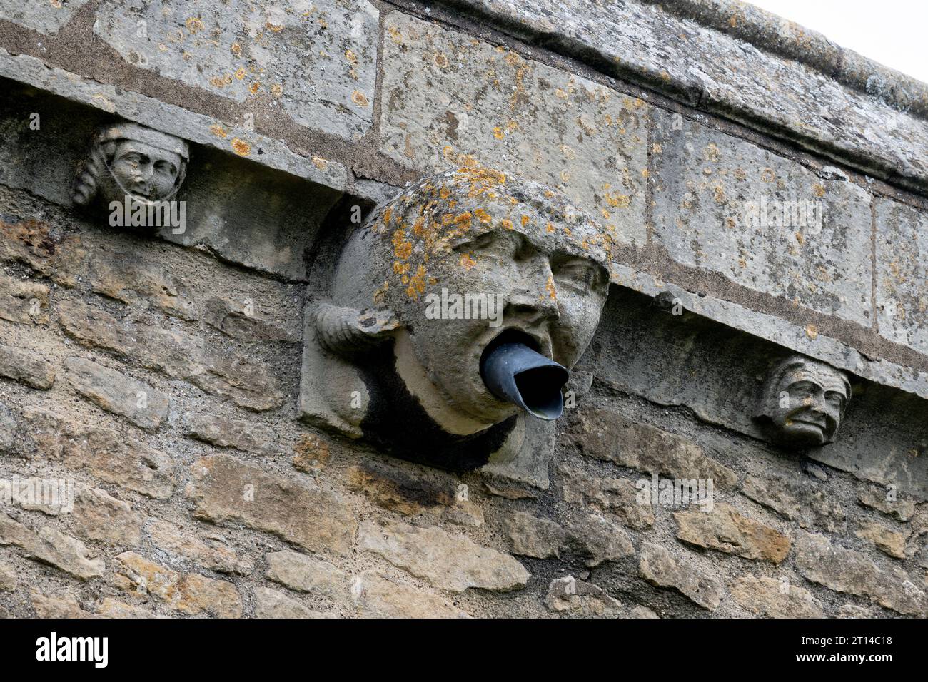 A gargoyle on St. Peter`s Church, Stanion, Northamptonshire, England ...